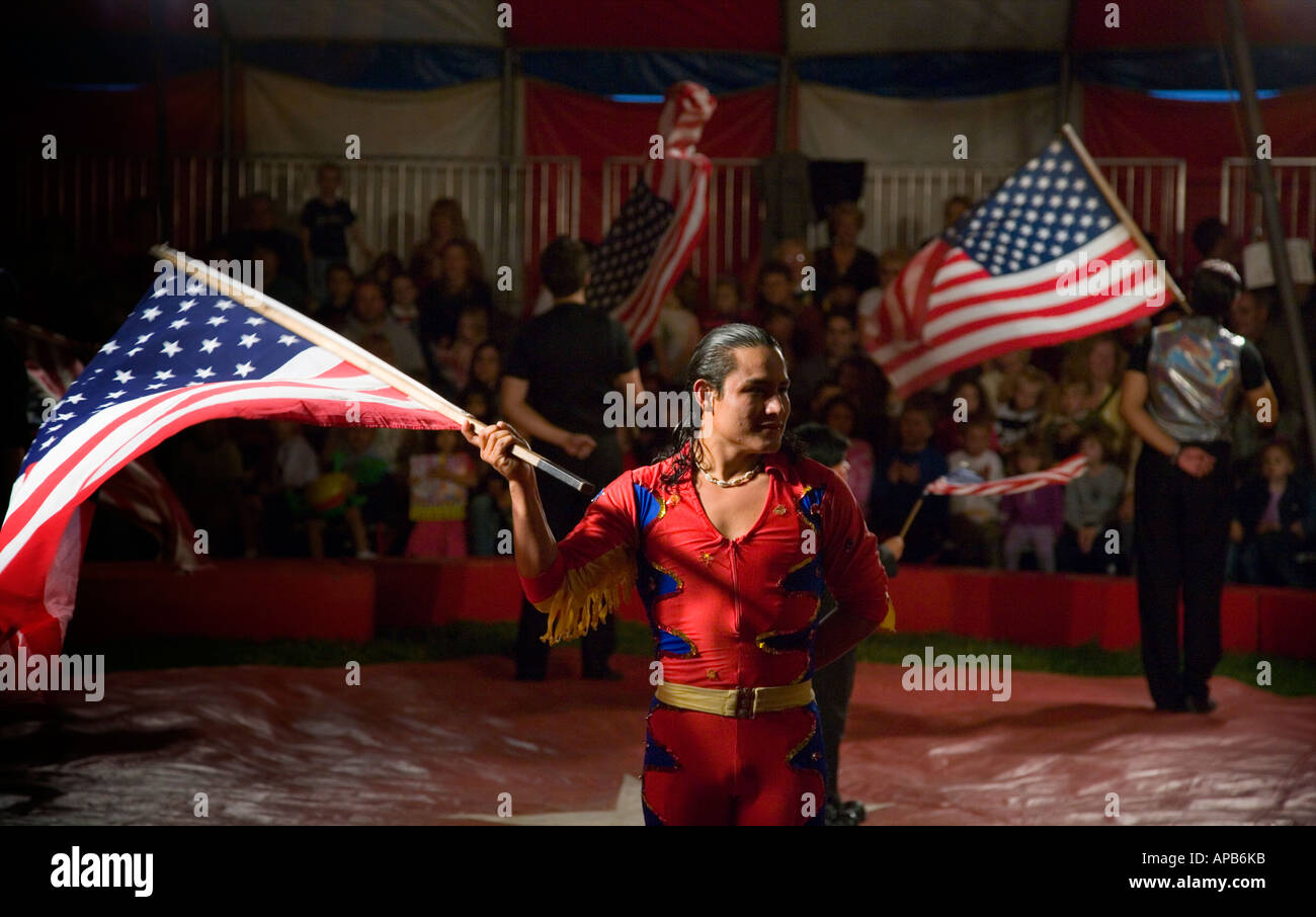 Circus perfomers waving an American flag Stock Photo - Alamy