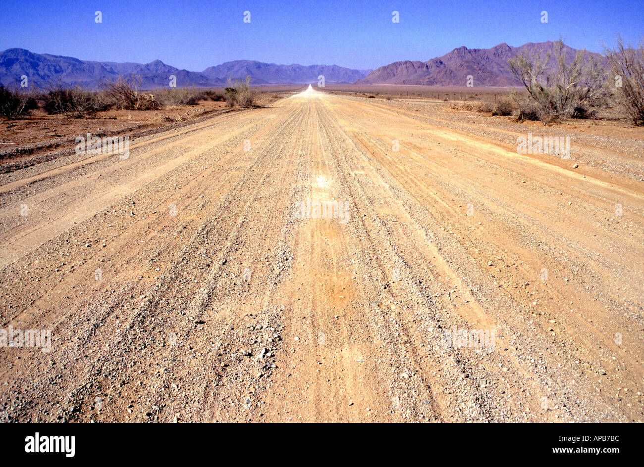 Long straight dirt road in Namibia Stock Photo - Alamy