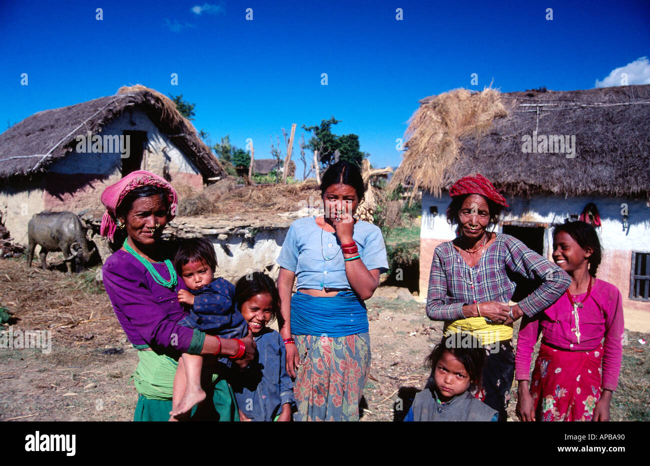Tharu family beside their farm, Western Nepal Stock Photo - Alamy