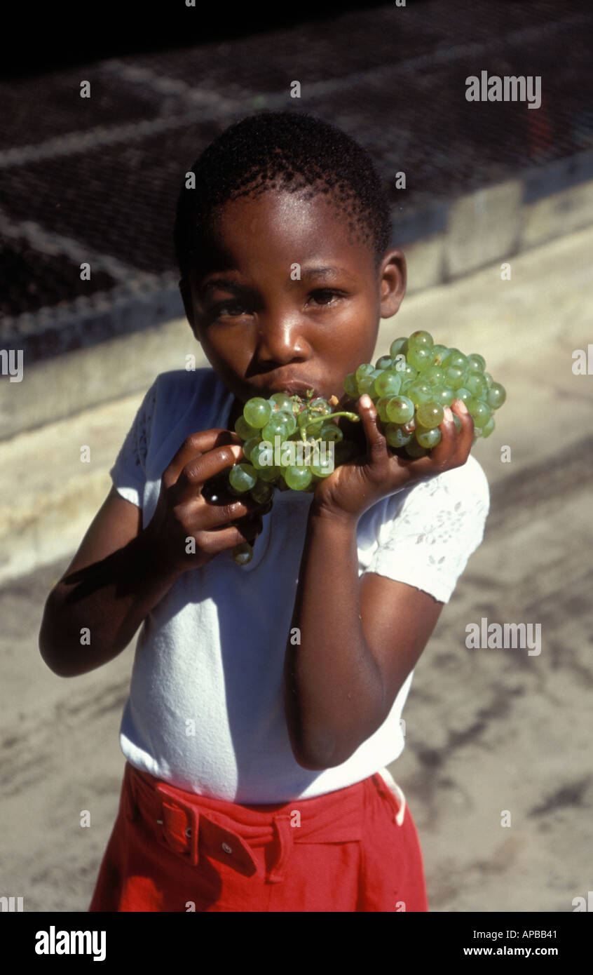 Africa children eating fruit hi-res stock photography and images - Alamy