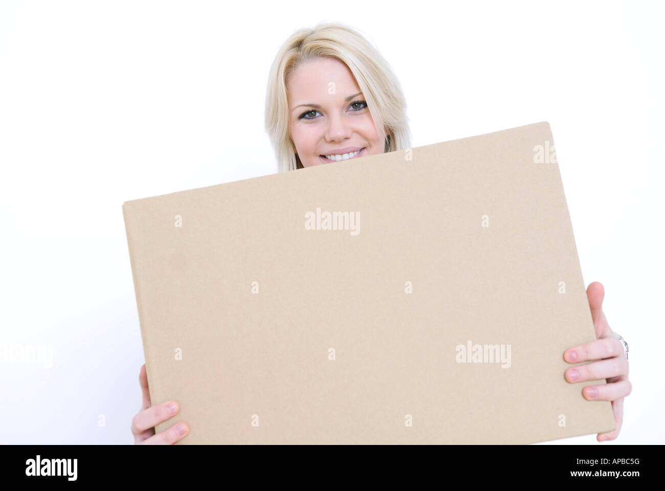 young female carrying cardboard box Stock Photo - Alamy