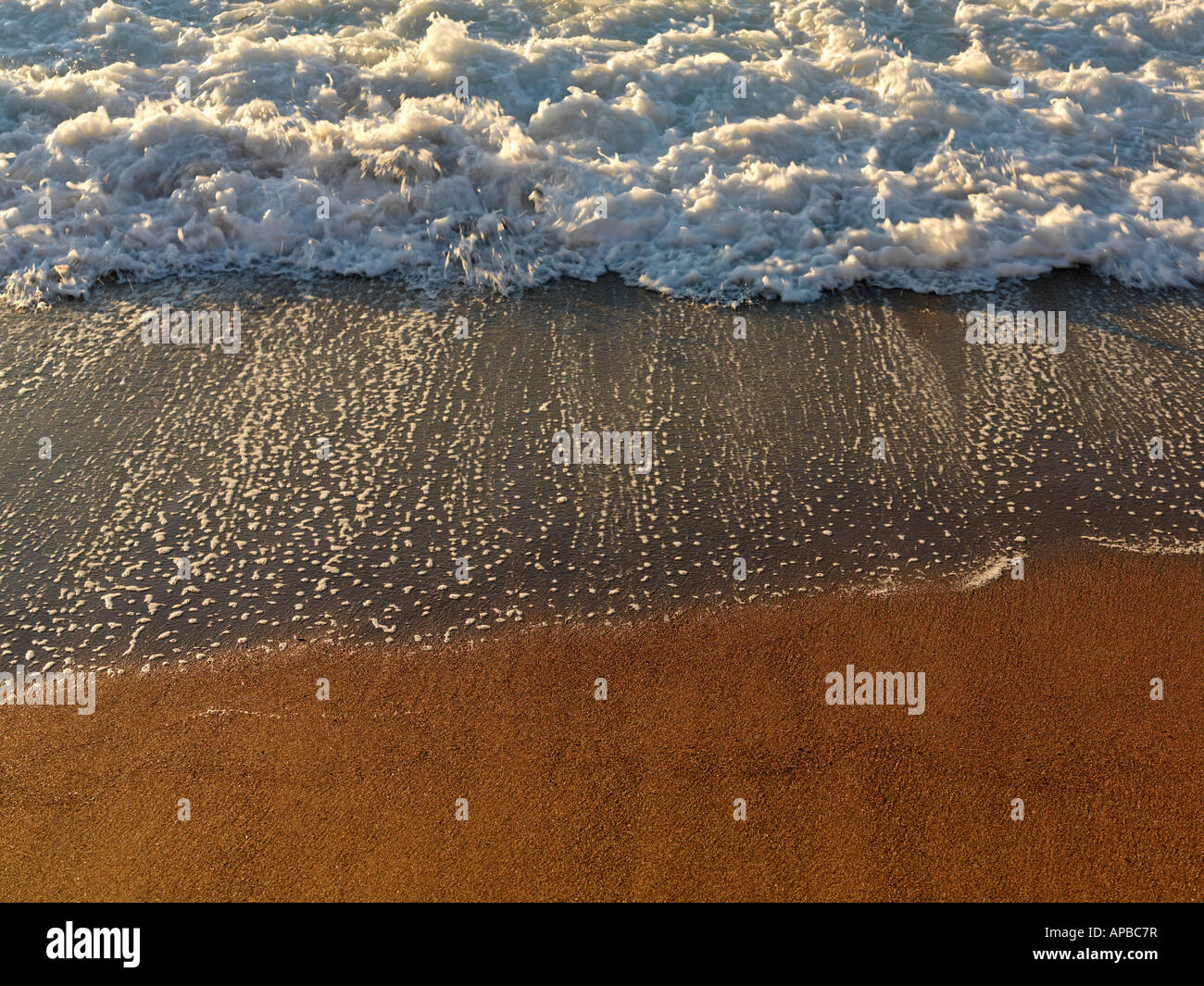 Canada Quebec Gaspesie Perce surf receding on sandy beach Stock Photo ...