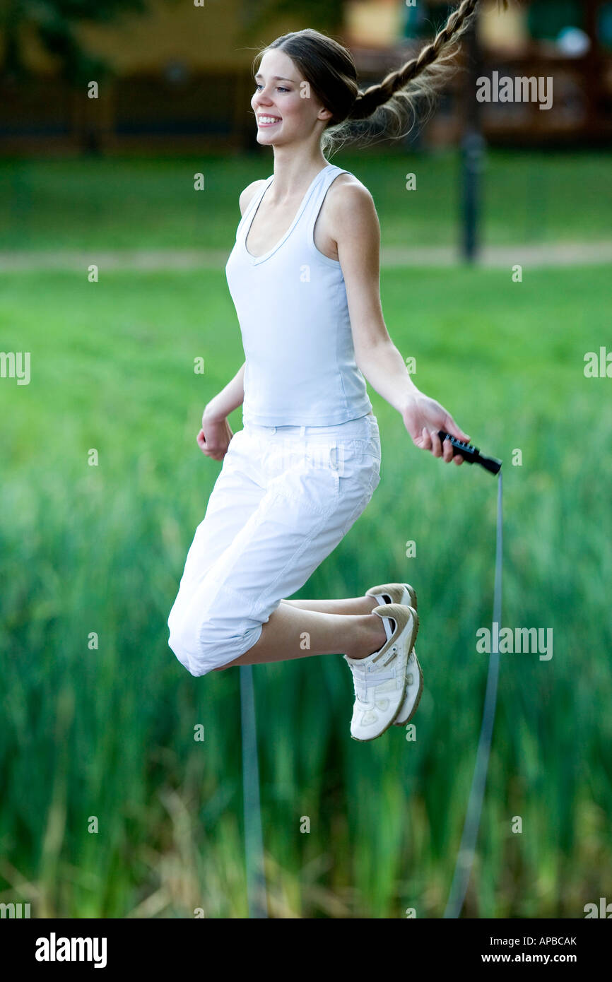 woman jumping on a jump rope Stock Photo - Alamy