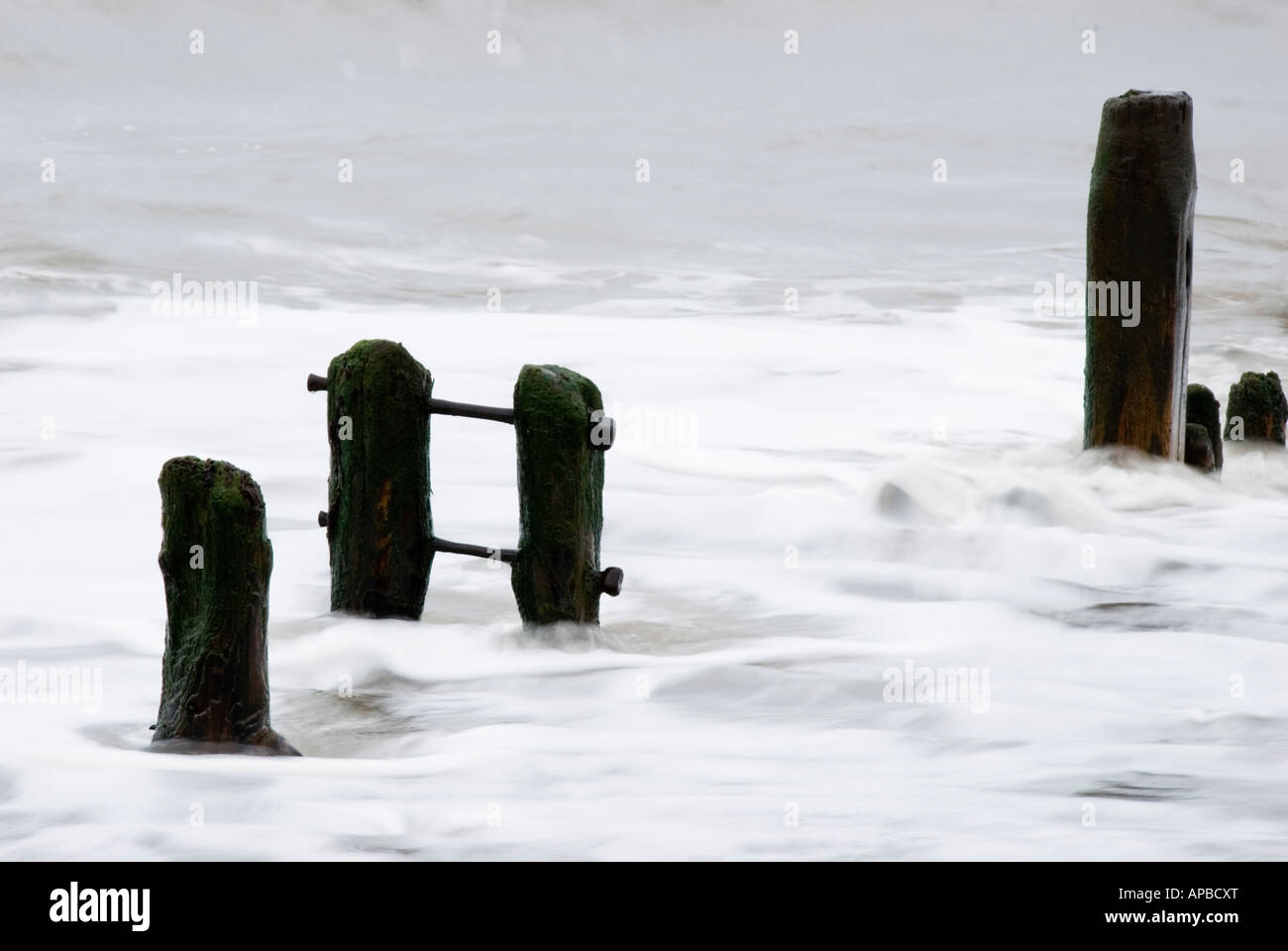Waves washing over the groynes at Sandsend Whitby North Yorkshire ...