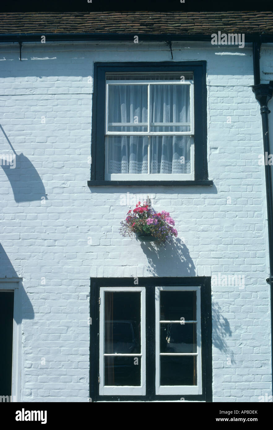 Black and white casement and sash windows on traditional white cottage ...