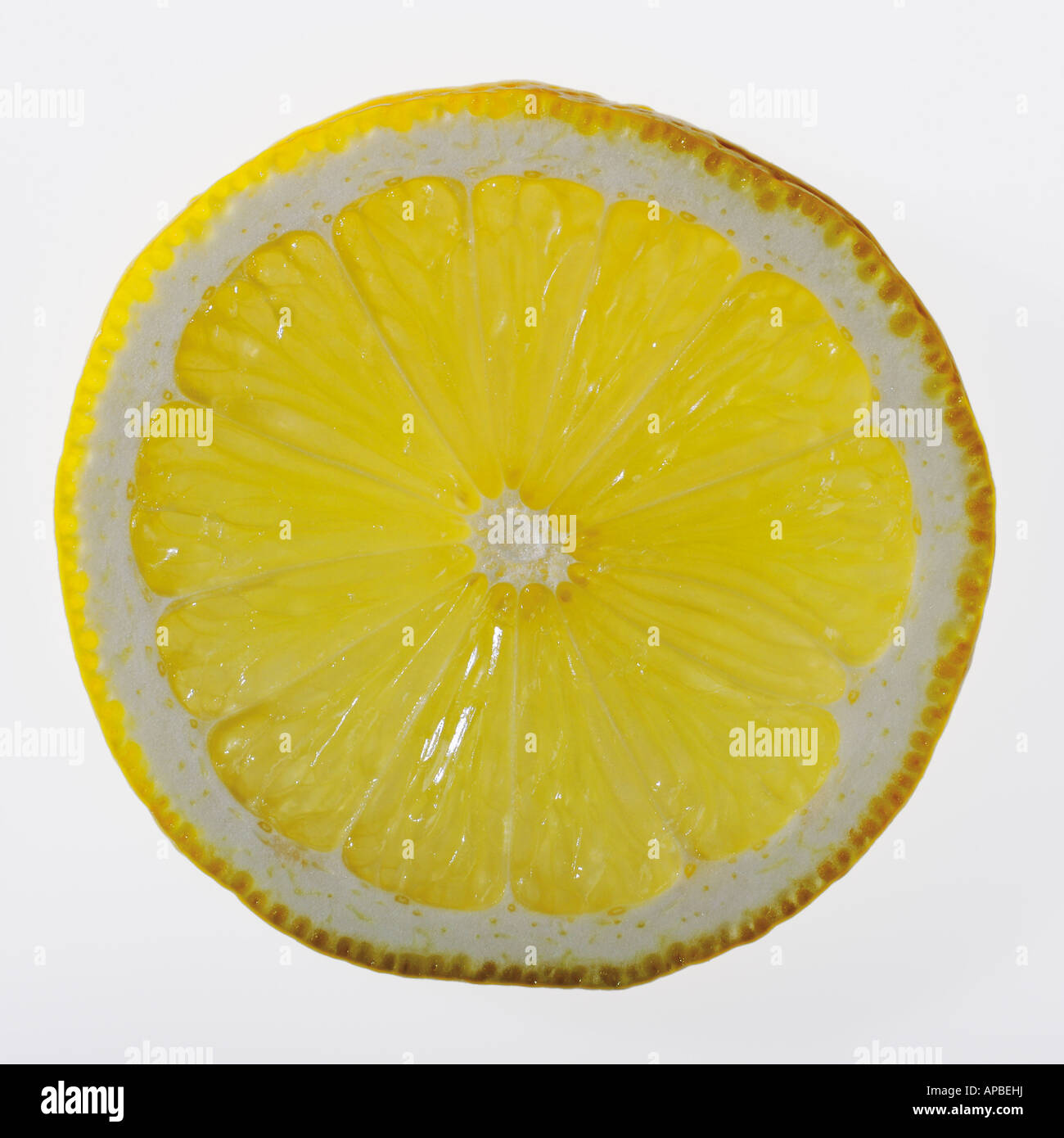 Single lemon slice on white background Stock Photo - Alamy