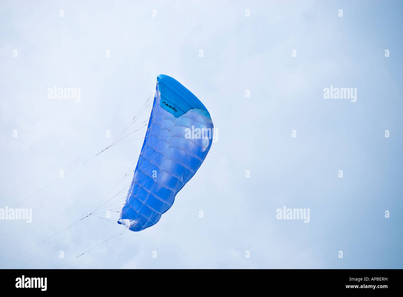A blue parakite sail against the sky Stock Photo - Alamy