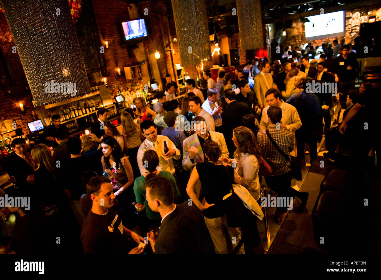 People at a nightclub mixer, talking and networking Stock Photo - Alamy