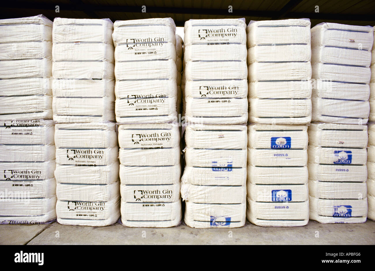 Agriculture - Bales of processed cotton sit on a loading dock at a ...