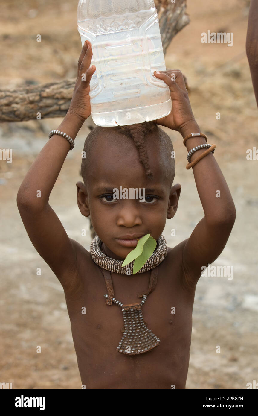 himba child fetching water Stock Photo - Alamy