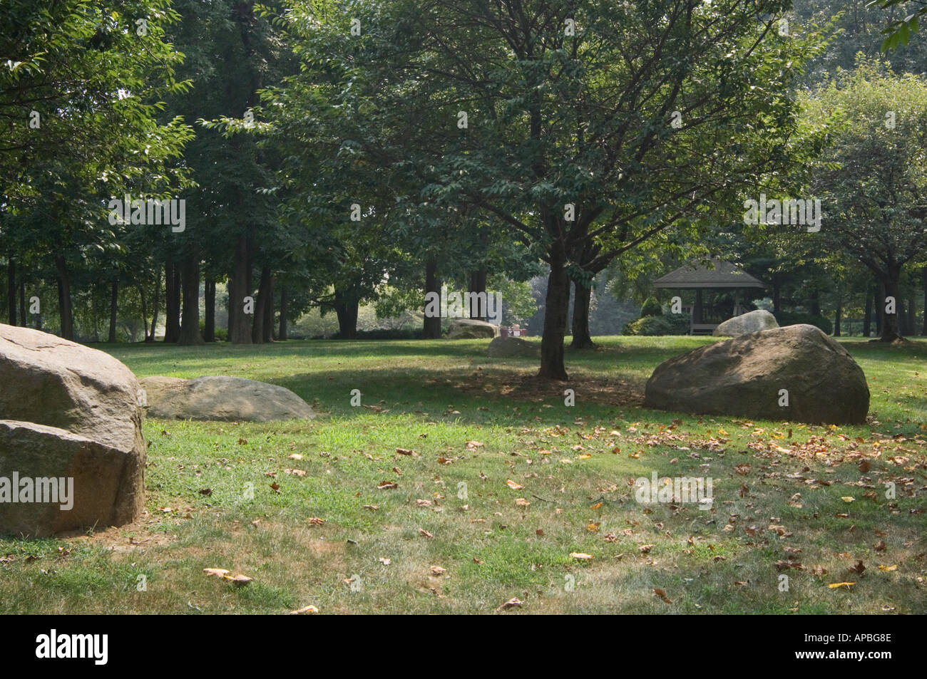 Color horizontal image of an idyllic municipal park with lawn trees ...