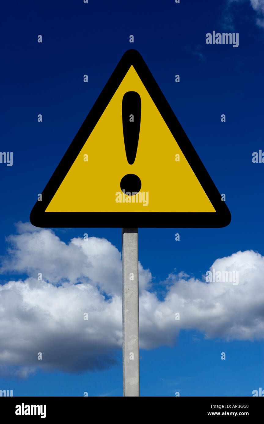YELLOW TRIANGULAR WARNING SIGN WITH BLACK EXCLAMATION MARK AND BLUE SKY ...