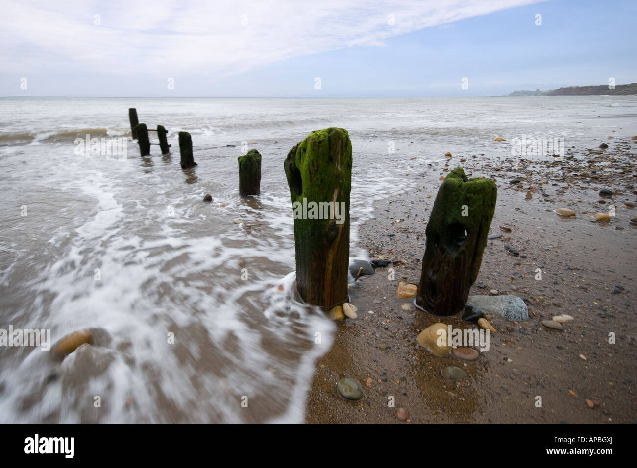 Waves washing over the groynes at Sandsend Whitby North Yorkshire ...