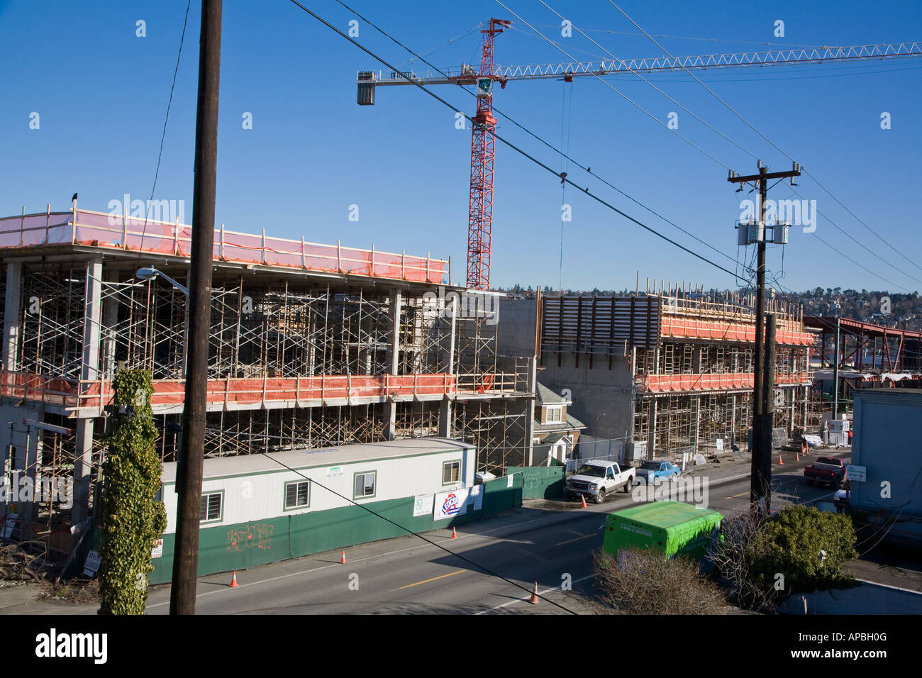 New construction around small old house Stock Photo - Alamy