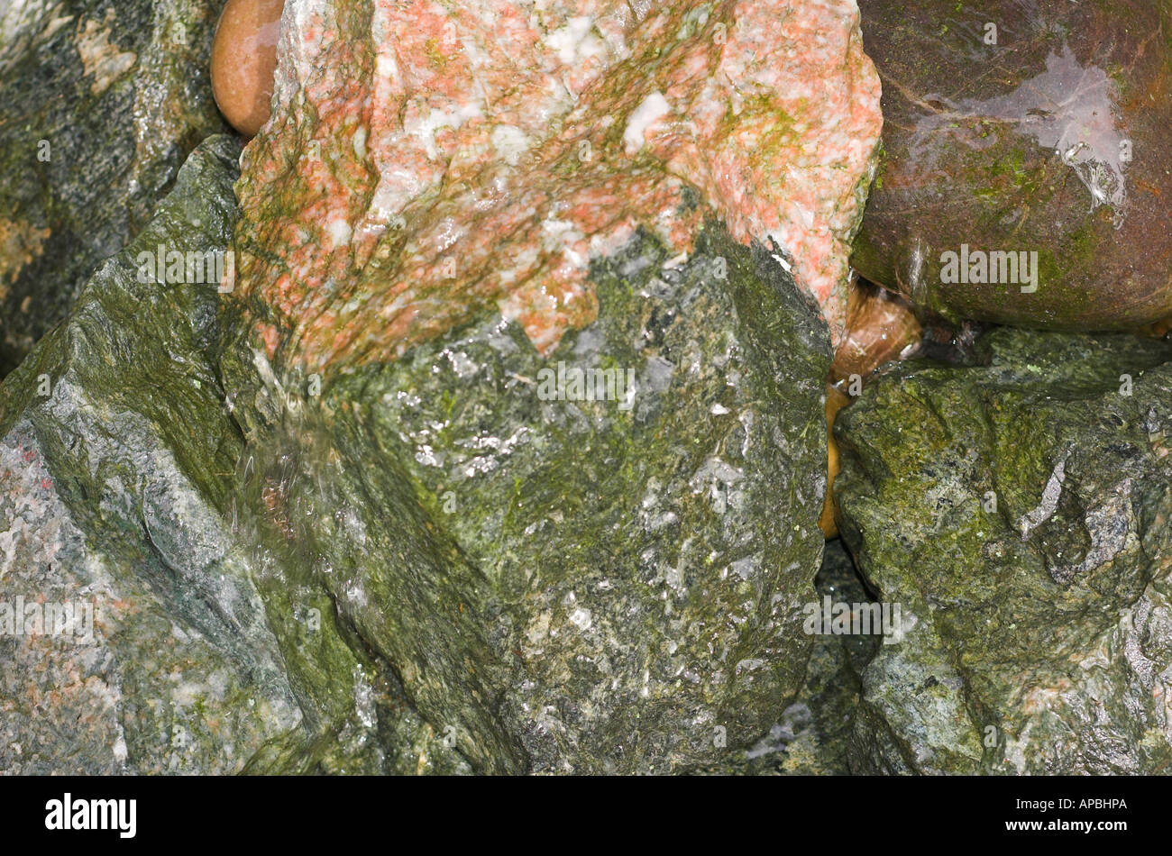 Domestic garden water feature rocks with water flowing over them ...