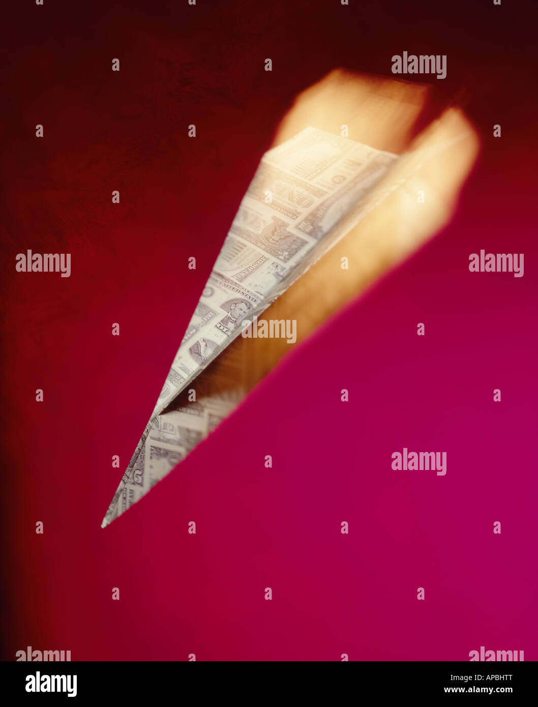Paper aeroplane made of dollar bills, crashing Stock Photo - Alamy