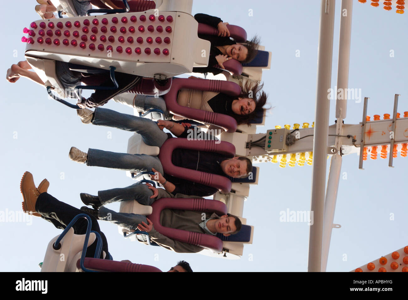 People on a fairground ride, UK (A Freak Out ride, a smaller version of ...