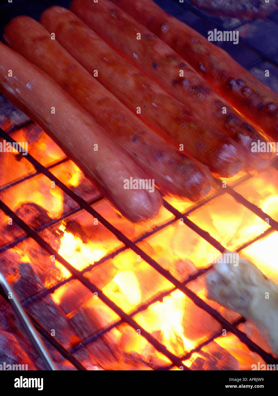 Summertime Scene of Hot Dogs on Grill Stock Photo - Alamy