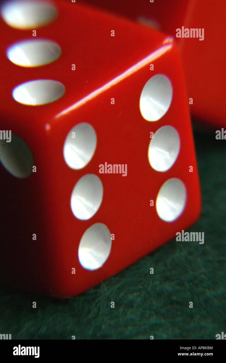 Red die on baize Stock Photo - Alamy