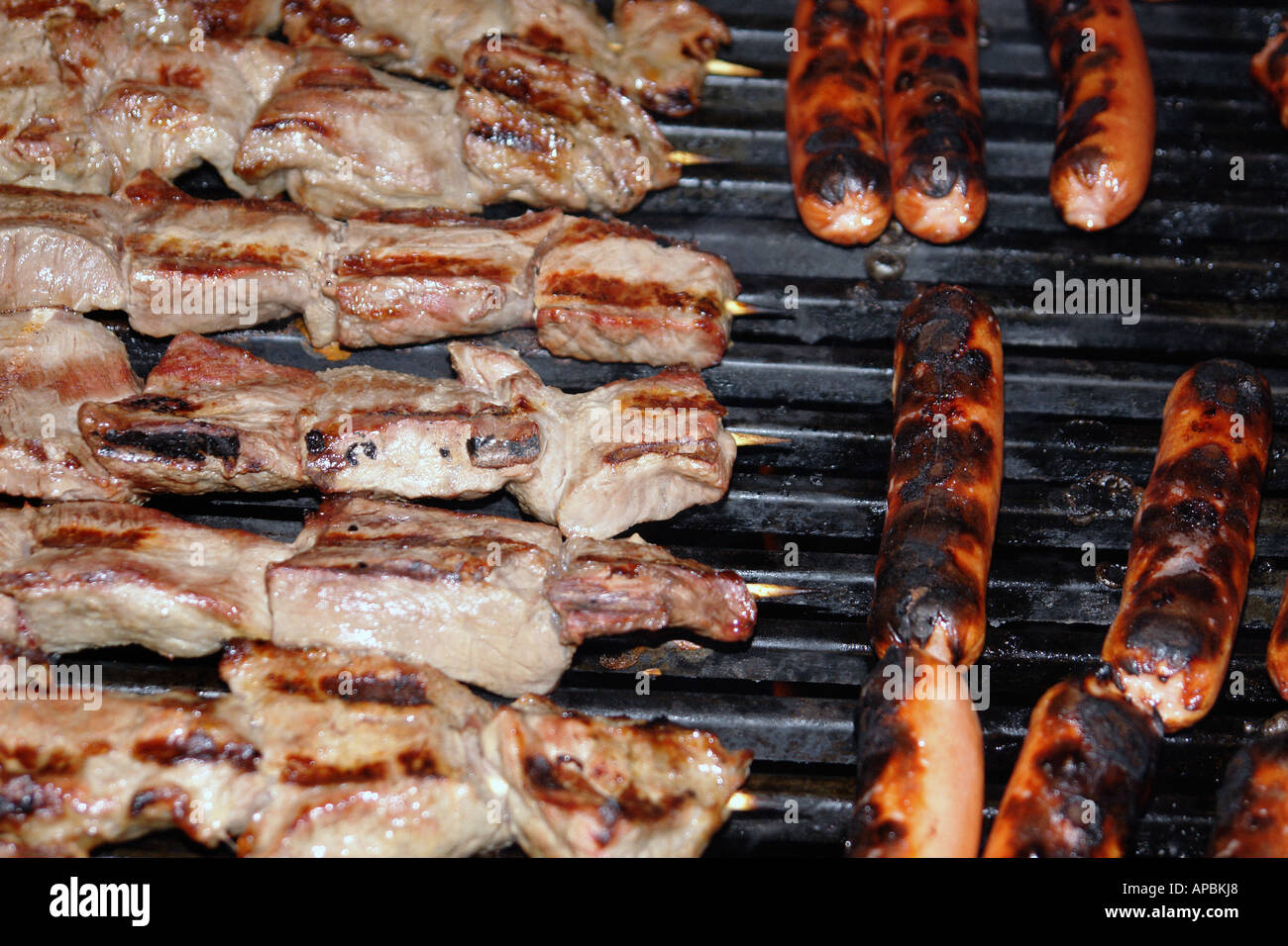 Summertime Scene of Meat on Grill Stock Photo - Alamy