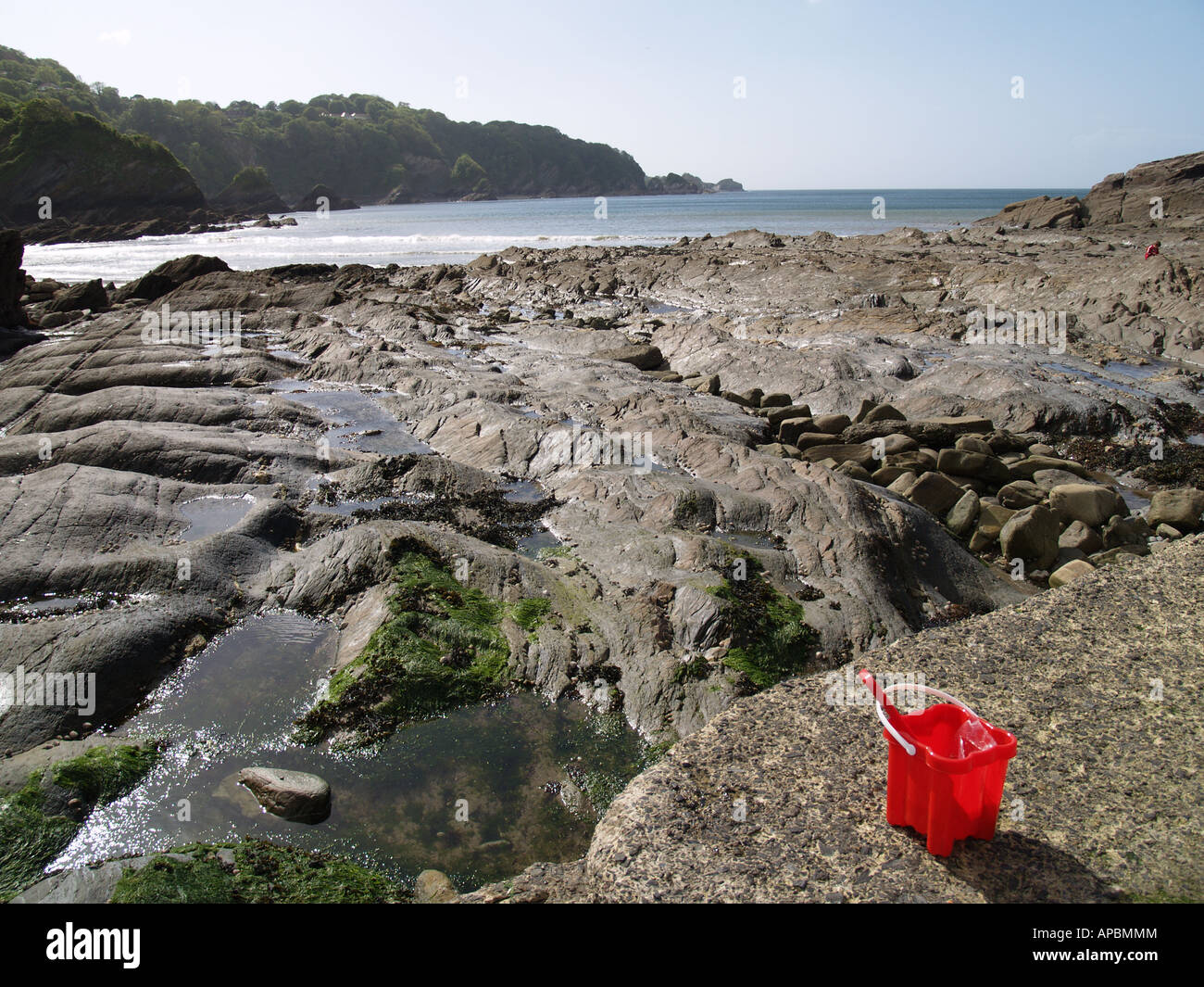 bucket beach and rocks combe martin north devon Stock Photo - Alamy
