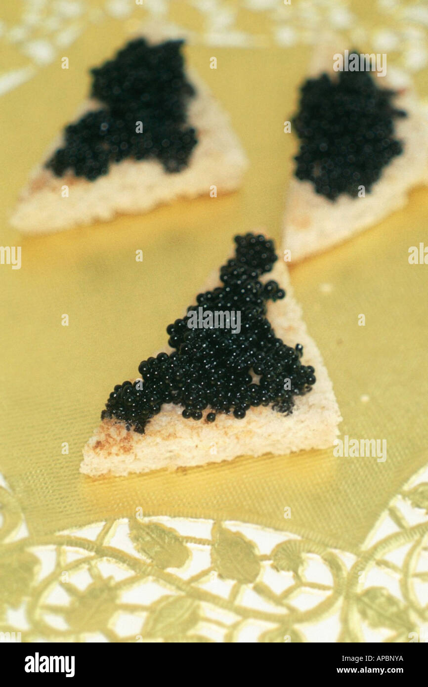 Caviar on Toast Points on Platter Lined with a Gold Doily Stock Photo ...