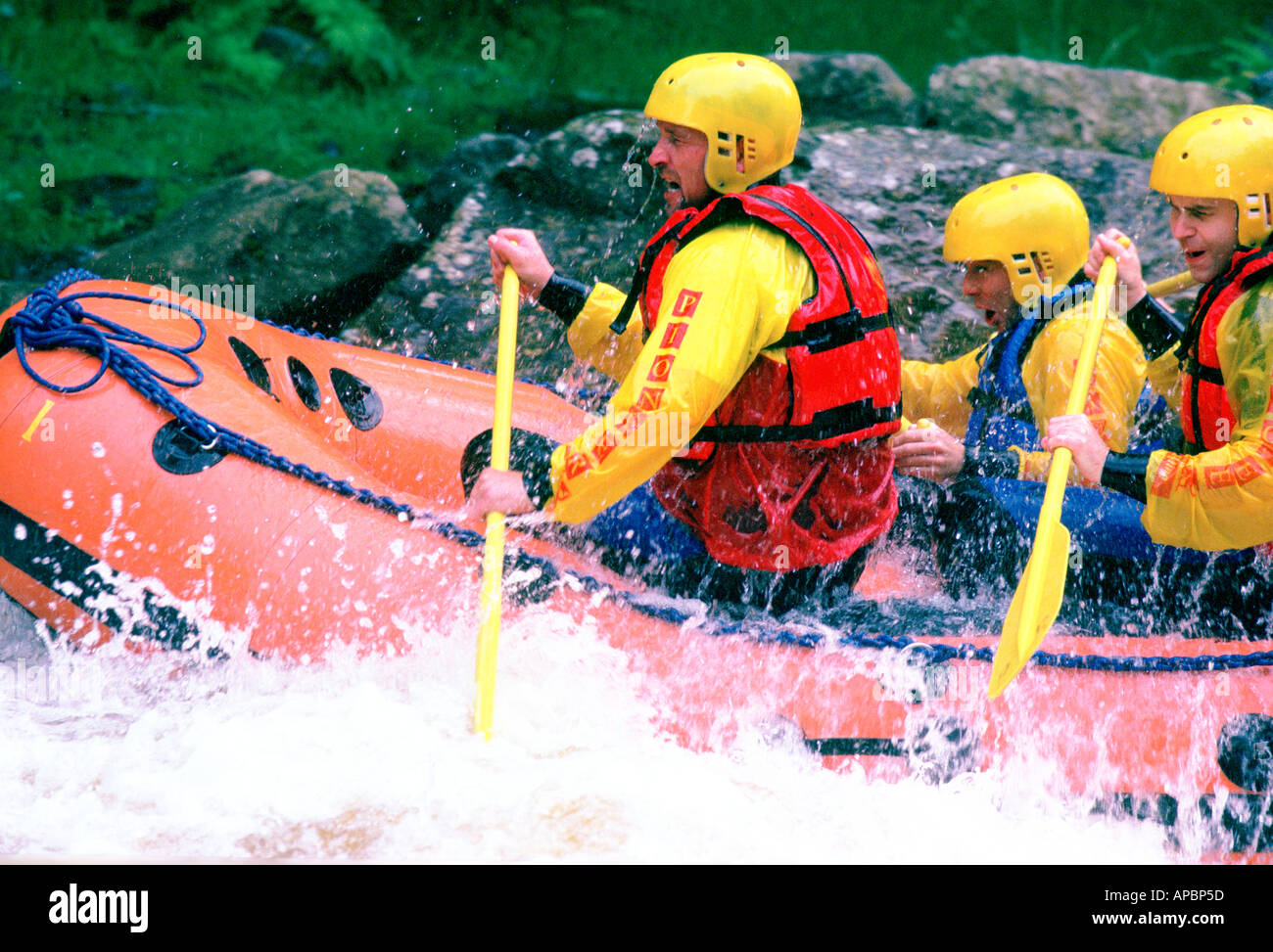Men paddling a whitewater rafting dinghy, Wales, UK Stock Photo - Alamy