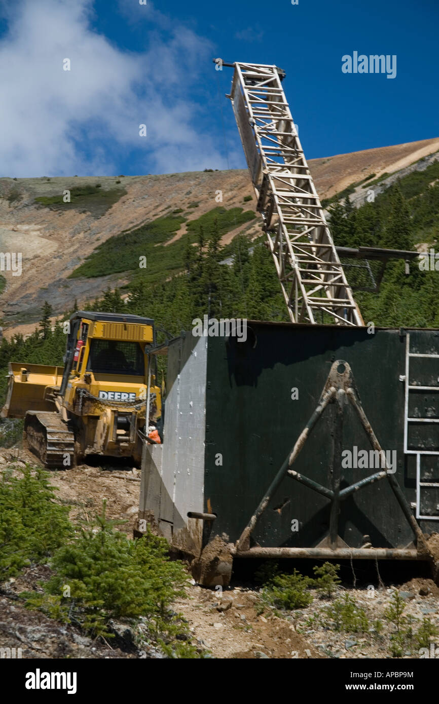 Bulldozer moving diamond drilling rig Astlais mountain BC Stock Photo ...