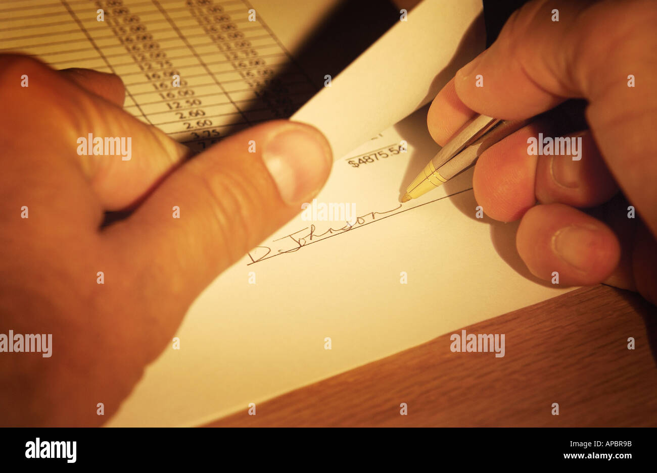 Man signing paperwork Stock Photo - Alamy