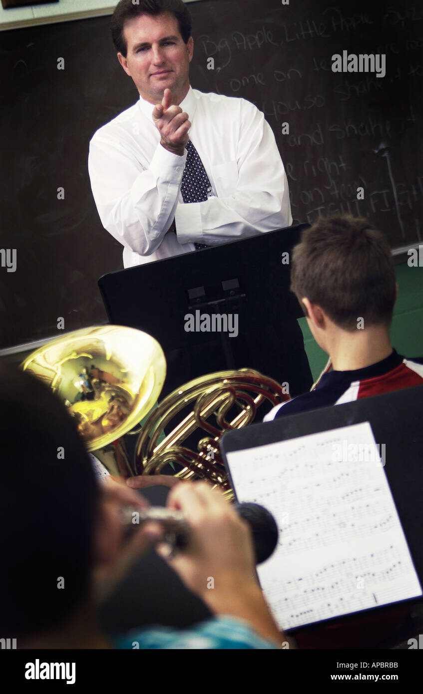Band teacher in class Stock Photo - Alamy