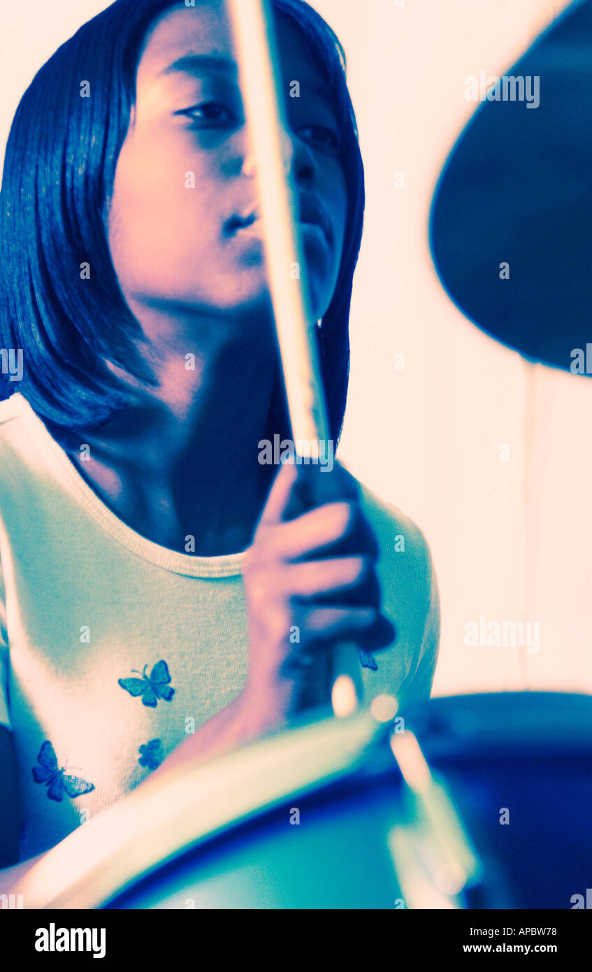 Girl playing drums Stock Photo - Alamy