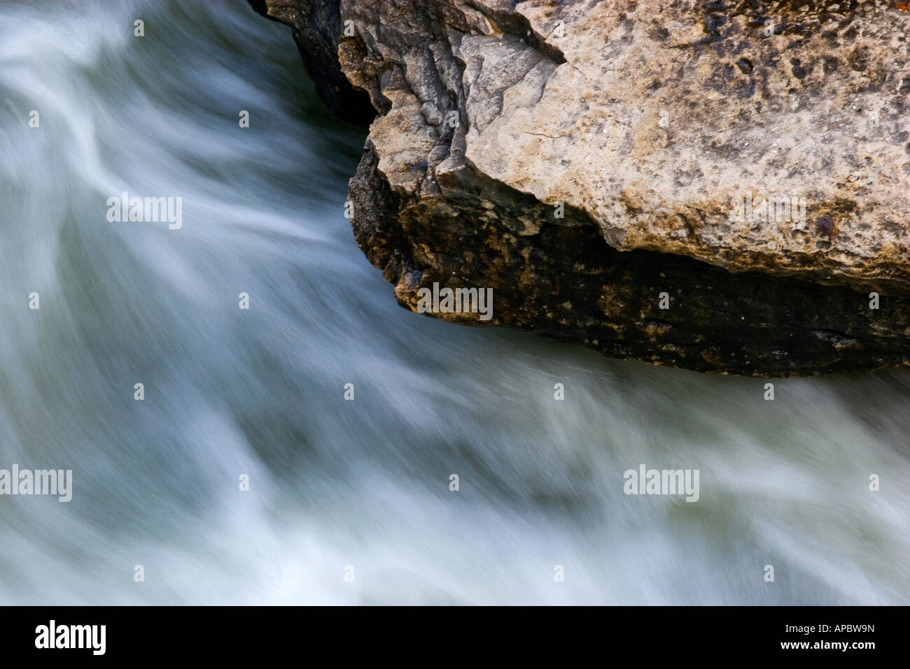 Water rushes past an outcropping below the water fall at the Tanyard ...