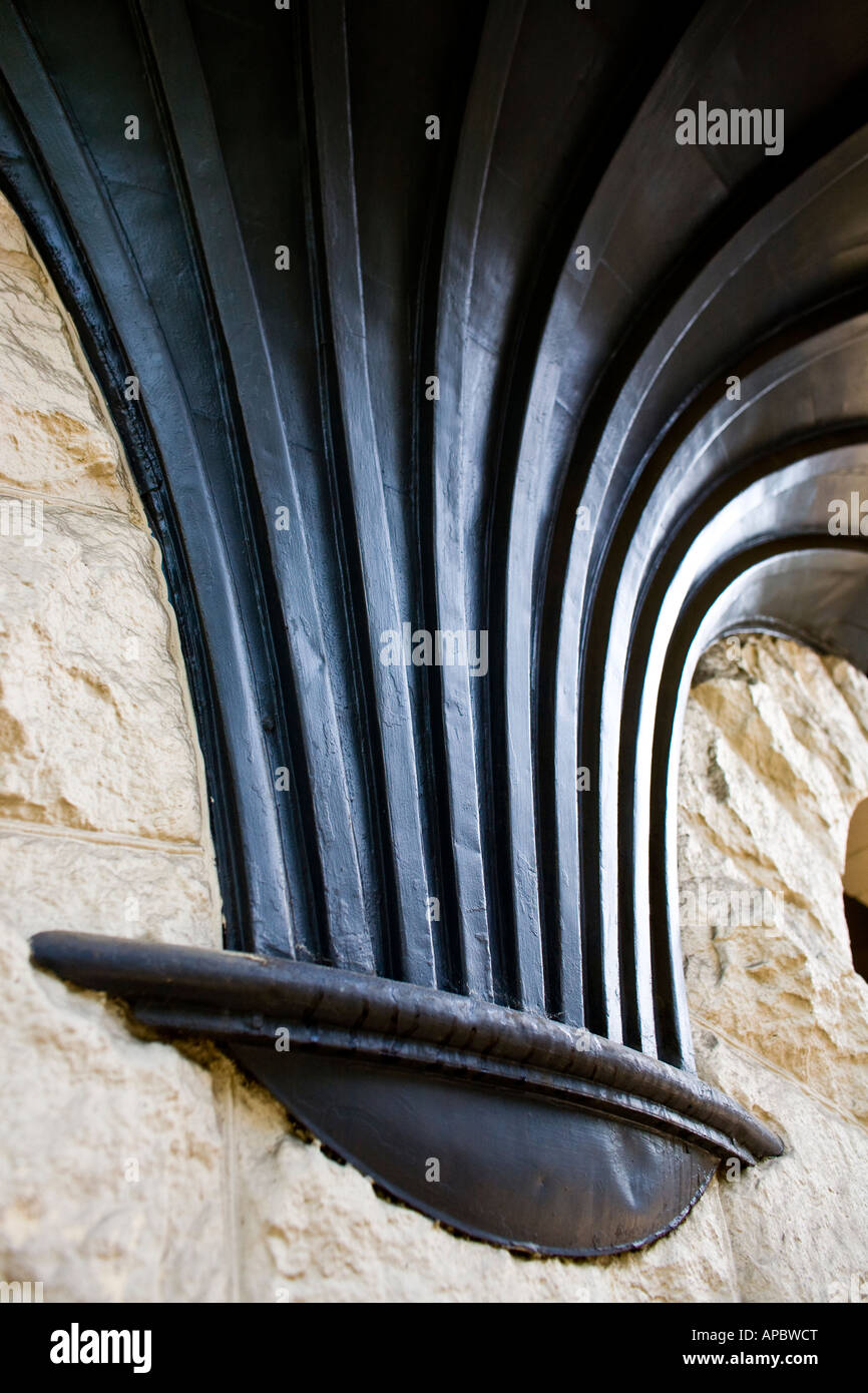 An architectural detail: a colum relief that splays upward onto the ...
