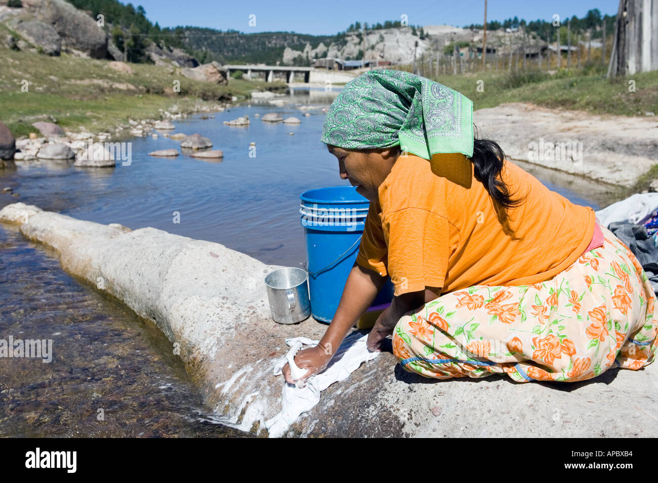 Woman doing her laundry in a river in Cusarare a native village in the ...
