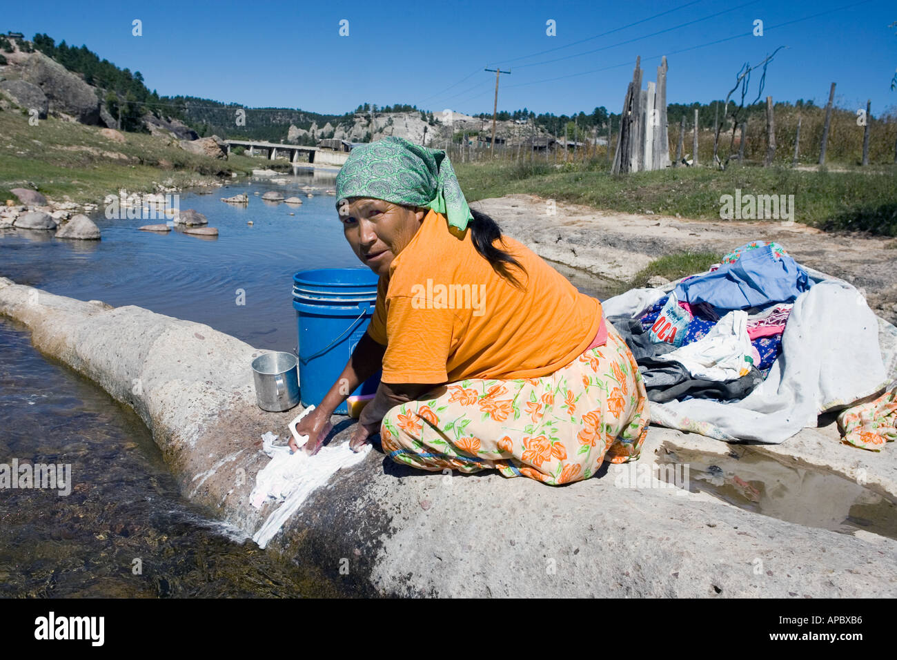 Woman is washing laundry in stream hi-res stock photography and images ...