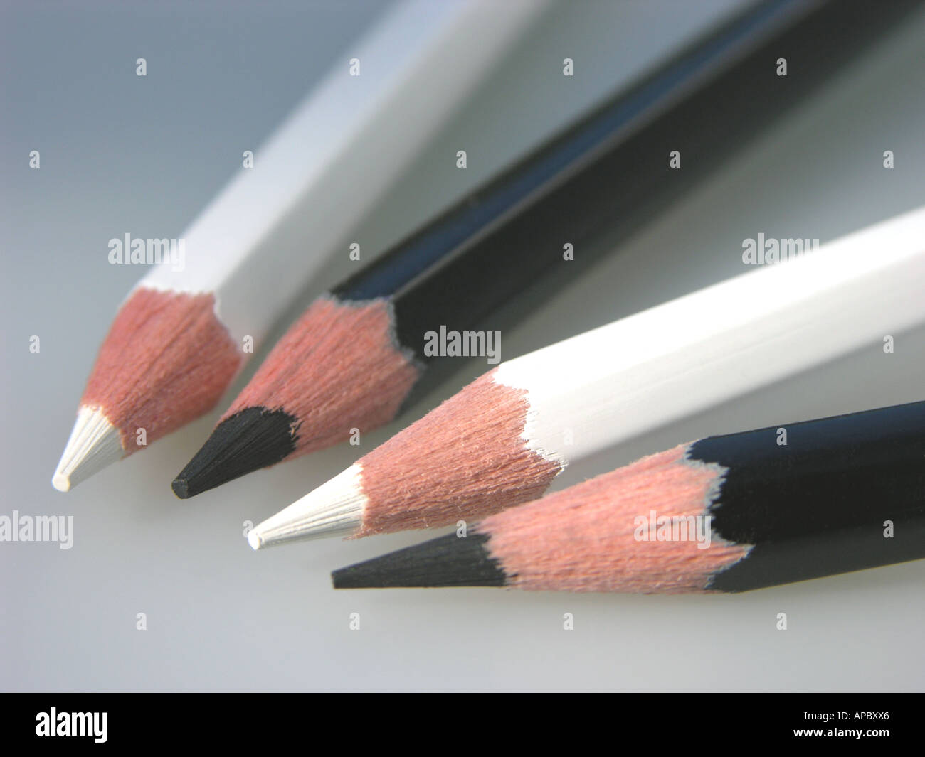 Four crayons, black and white Stock Photo - Alamy