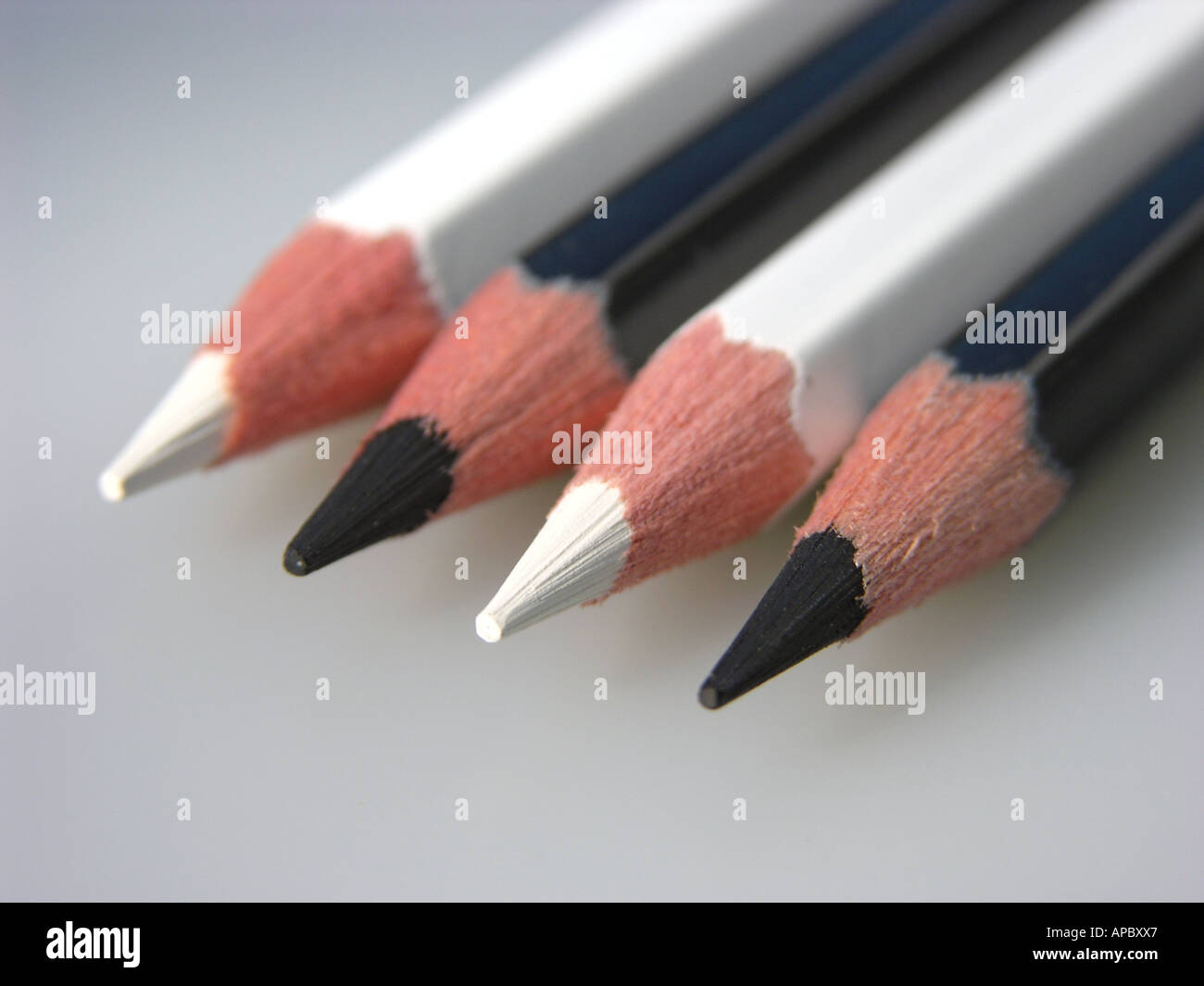 Four crayons, black and white Stock Photo - Alamy