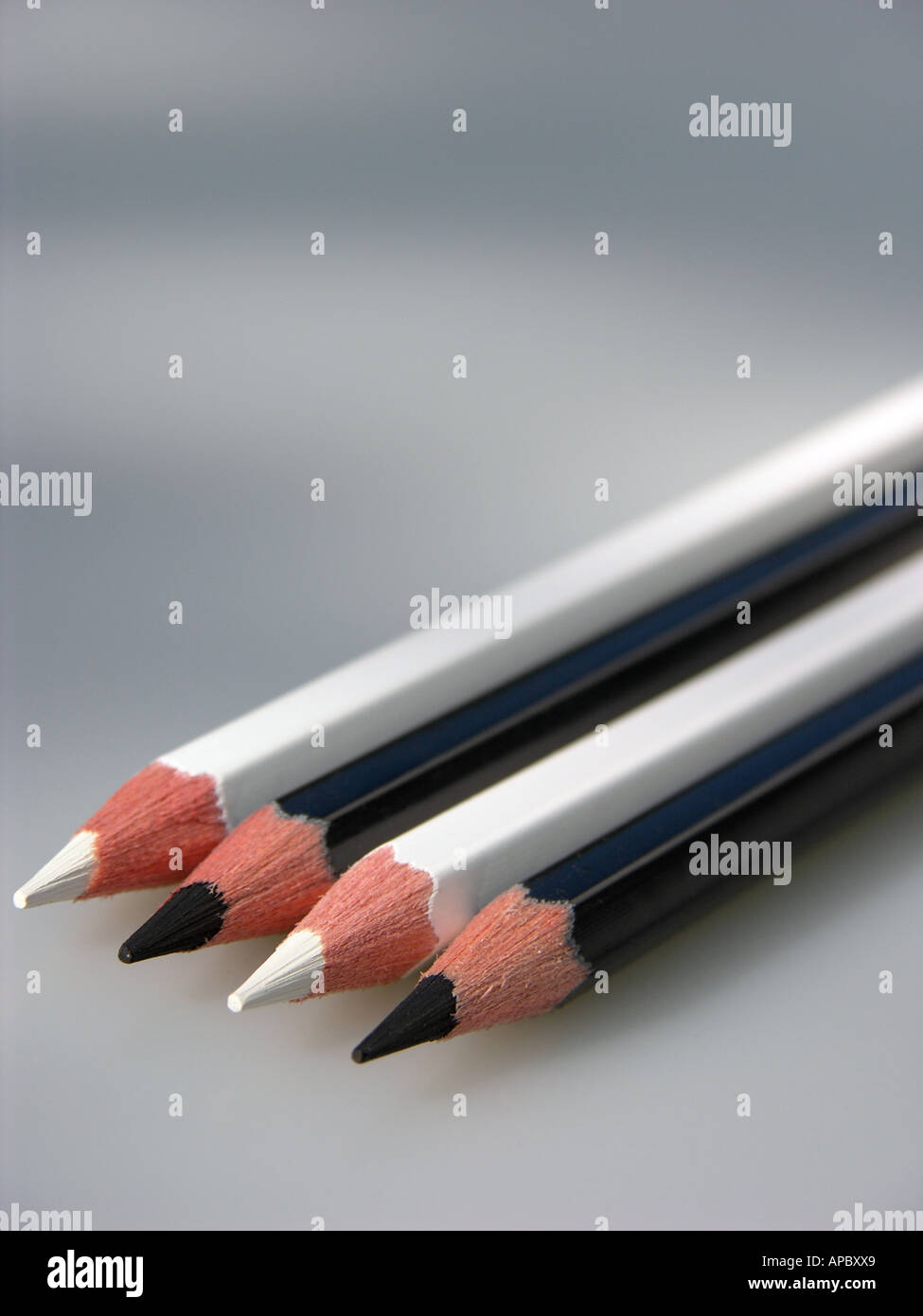 Four crayons, black and white Stock Photo - Alamy