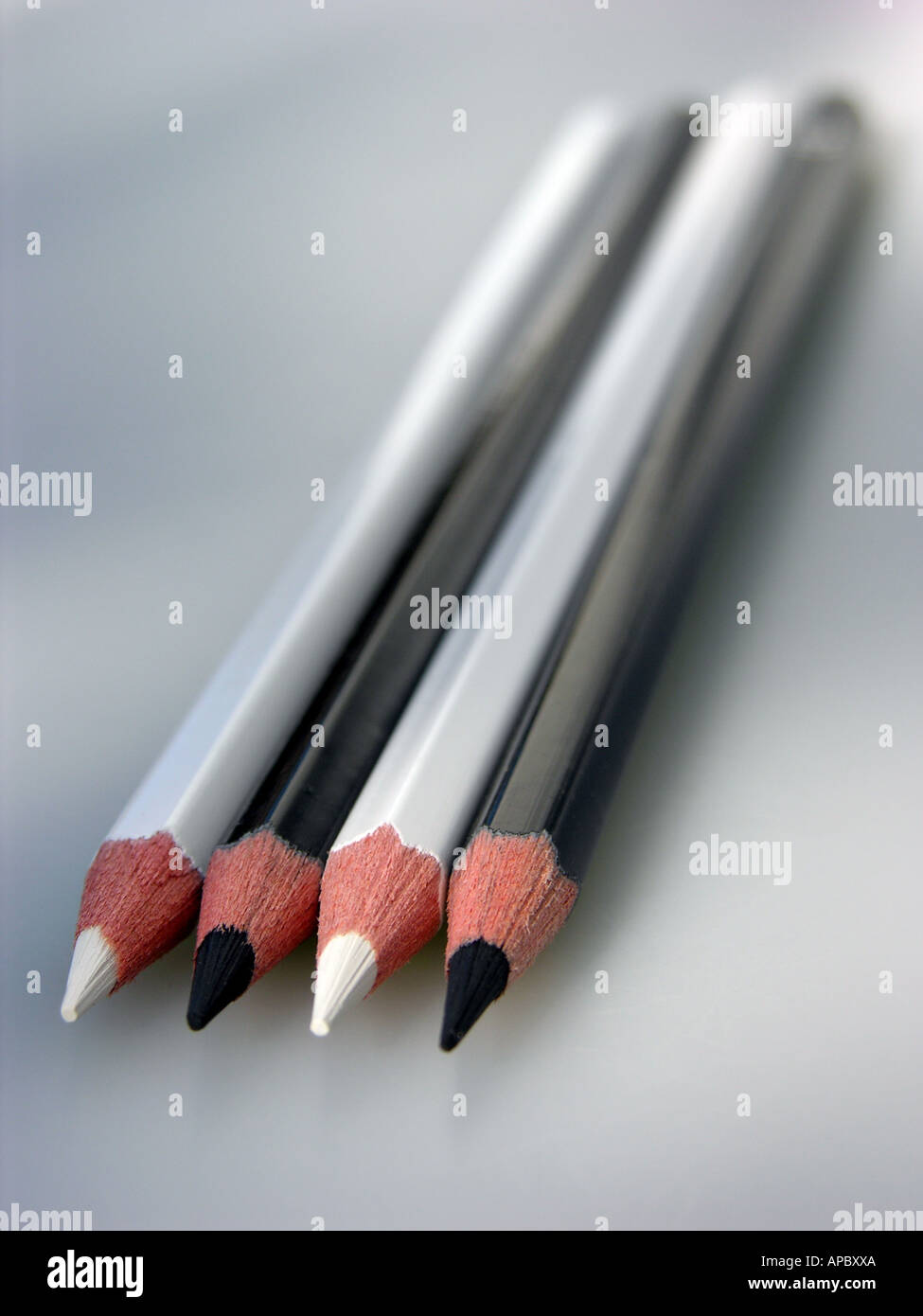 Four crayons, black and white Stock Photo - Alamy