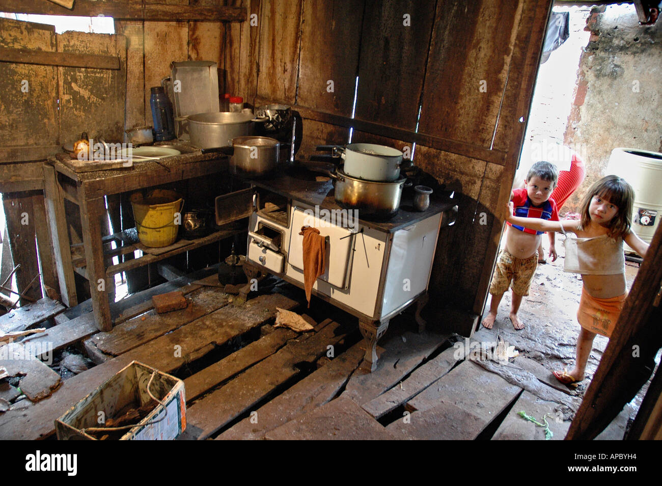 Kitchen with rotten floor in, Encarnacion, Paraguay. The nearby dam ...
