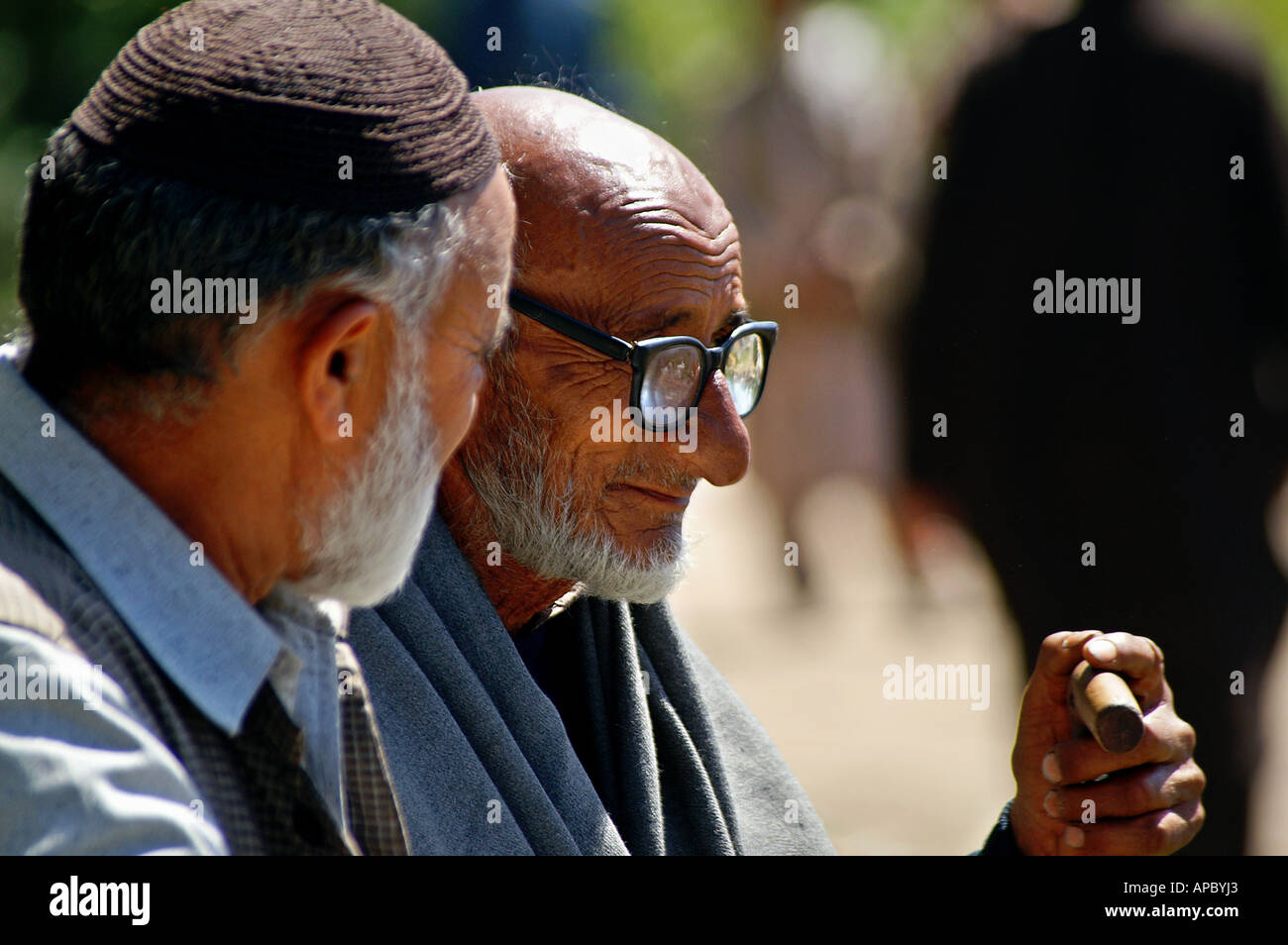 Two old men discussing during a distribution of relief items for ...