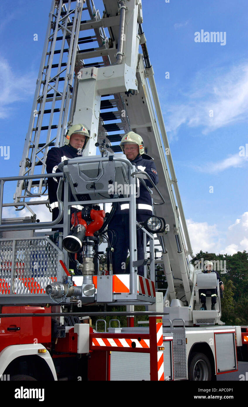 Firemen with special ladder Stock Photo - Alamy