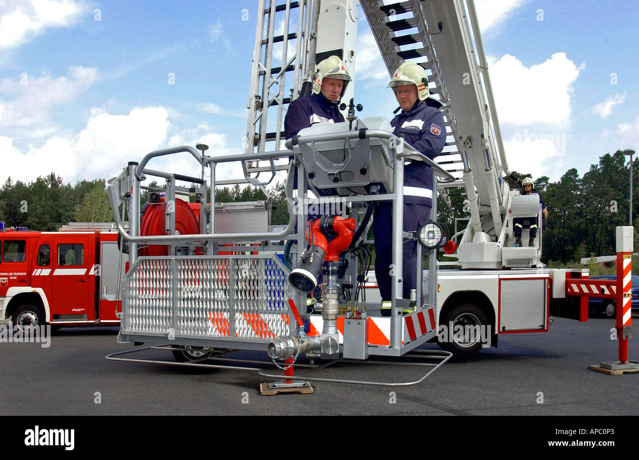 Firemen with special ladder Stock Photo - Alamy