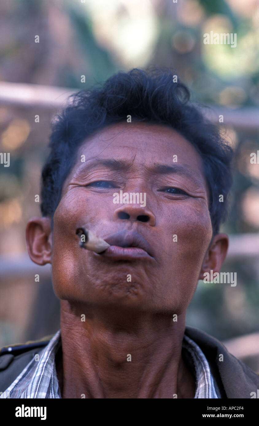 Man smoking a cheroot Don Dhet Mekong Islands Southern Laos Stock Photo ...