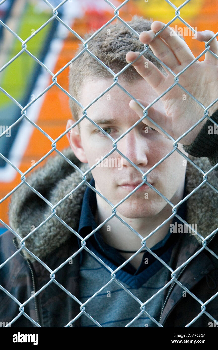 young teenage teenager rebellious male youth graffiti brick wall ...