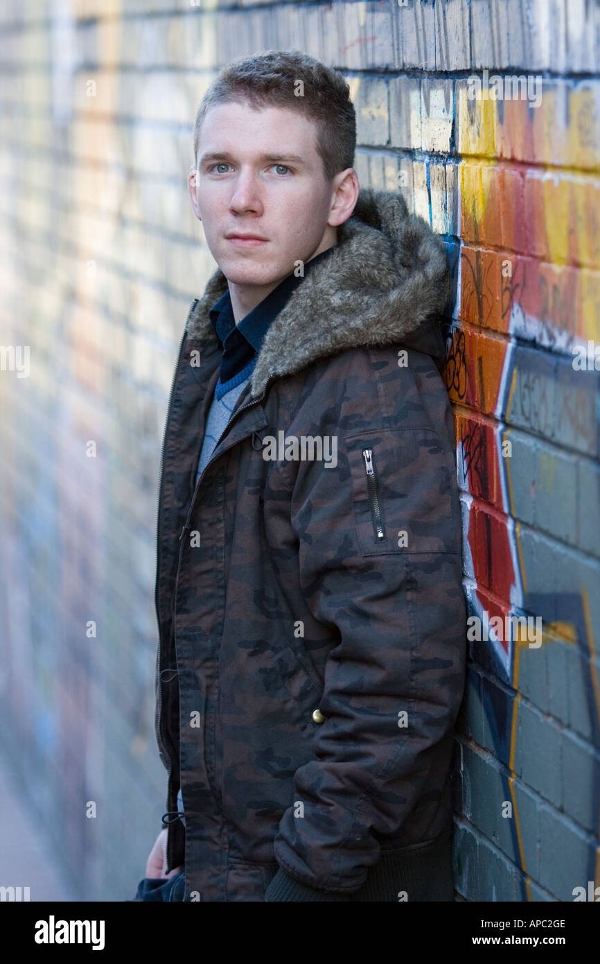 young teenage teenager rebellious male youth graffiti brick wall ...