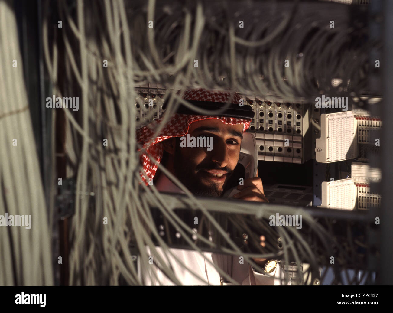 Saudi Arabian technician at switch board in telephone switch center in ...