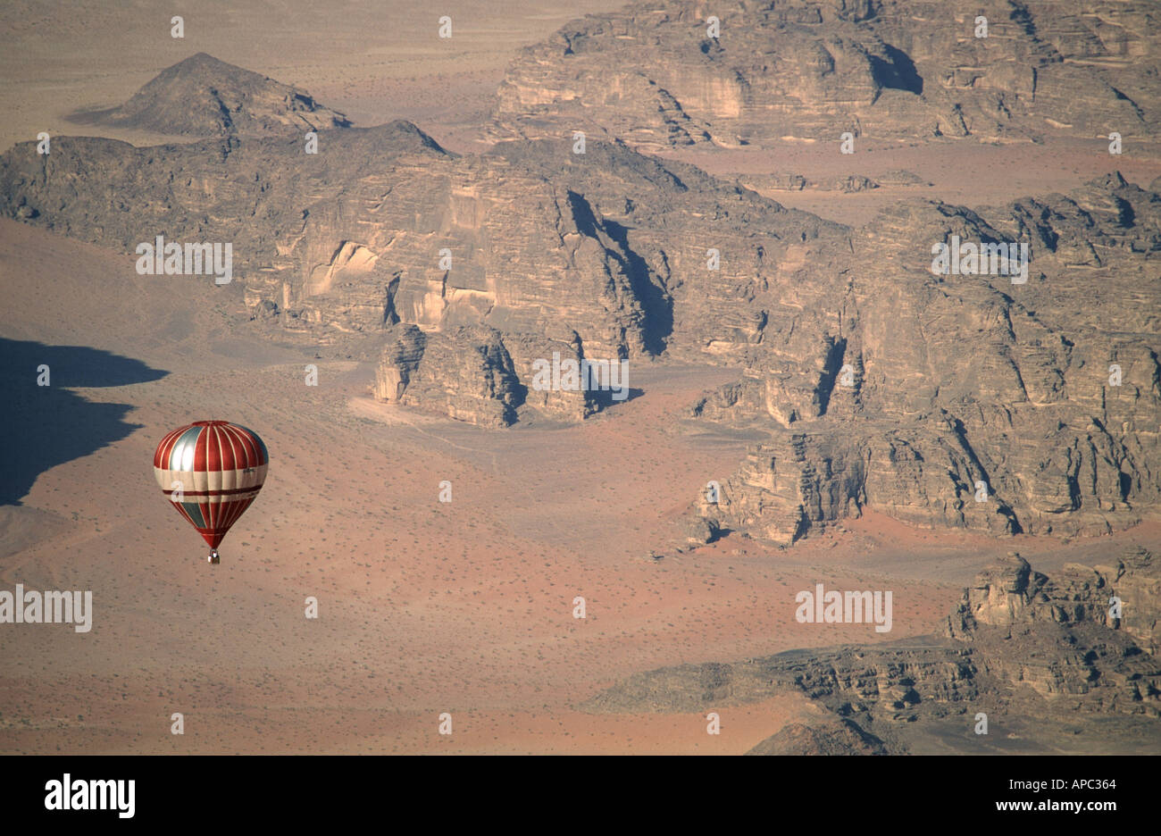 Hot air balloon flying over wadi Rum during balloon rally Stock Photo ...