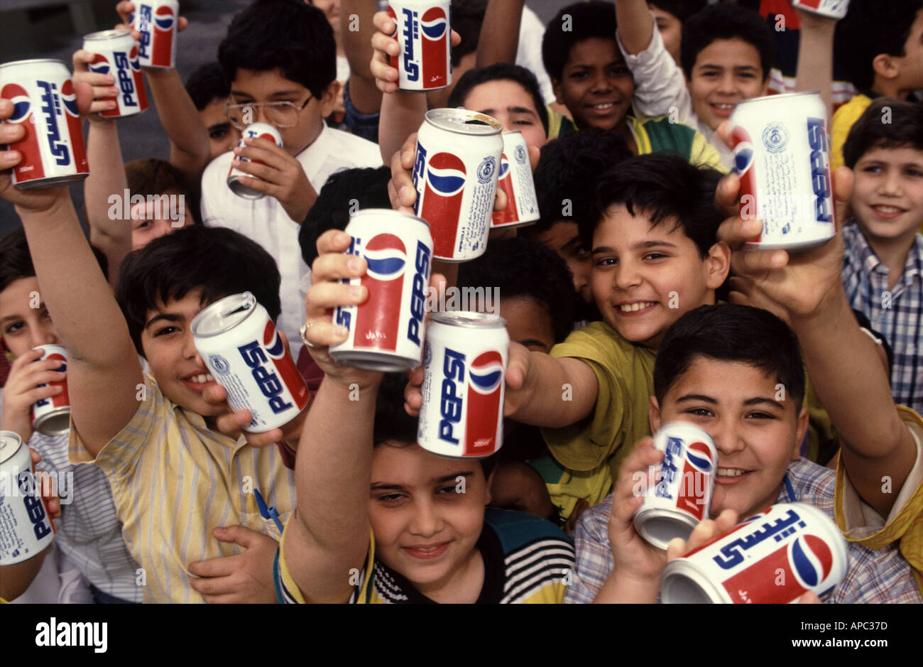 Young schoolboys in Riyadh Saudi Arabia with Pepsi cans Stock Photo - Alamy