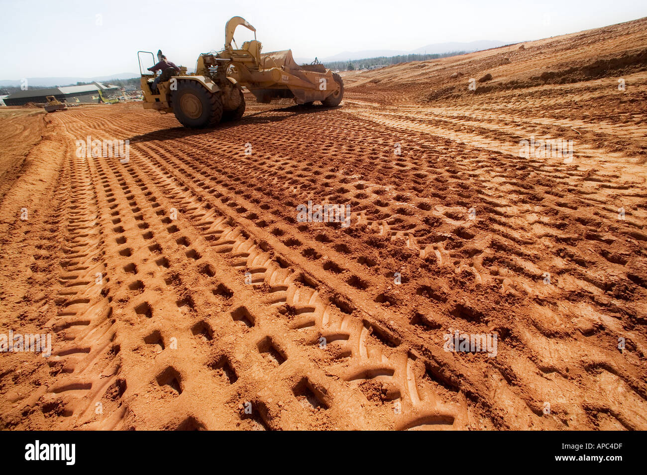 Yellow Industrial Equipment and Red Dirt 5 Stock Photo - Alamy
